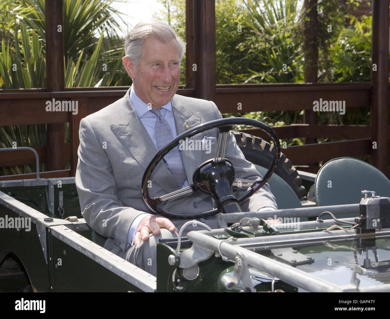 The Prince of Wales sits in a 1948 open Land Rover during a visit to ...