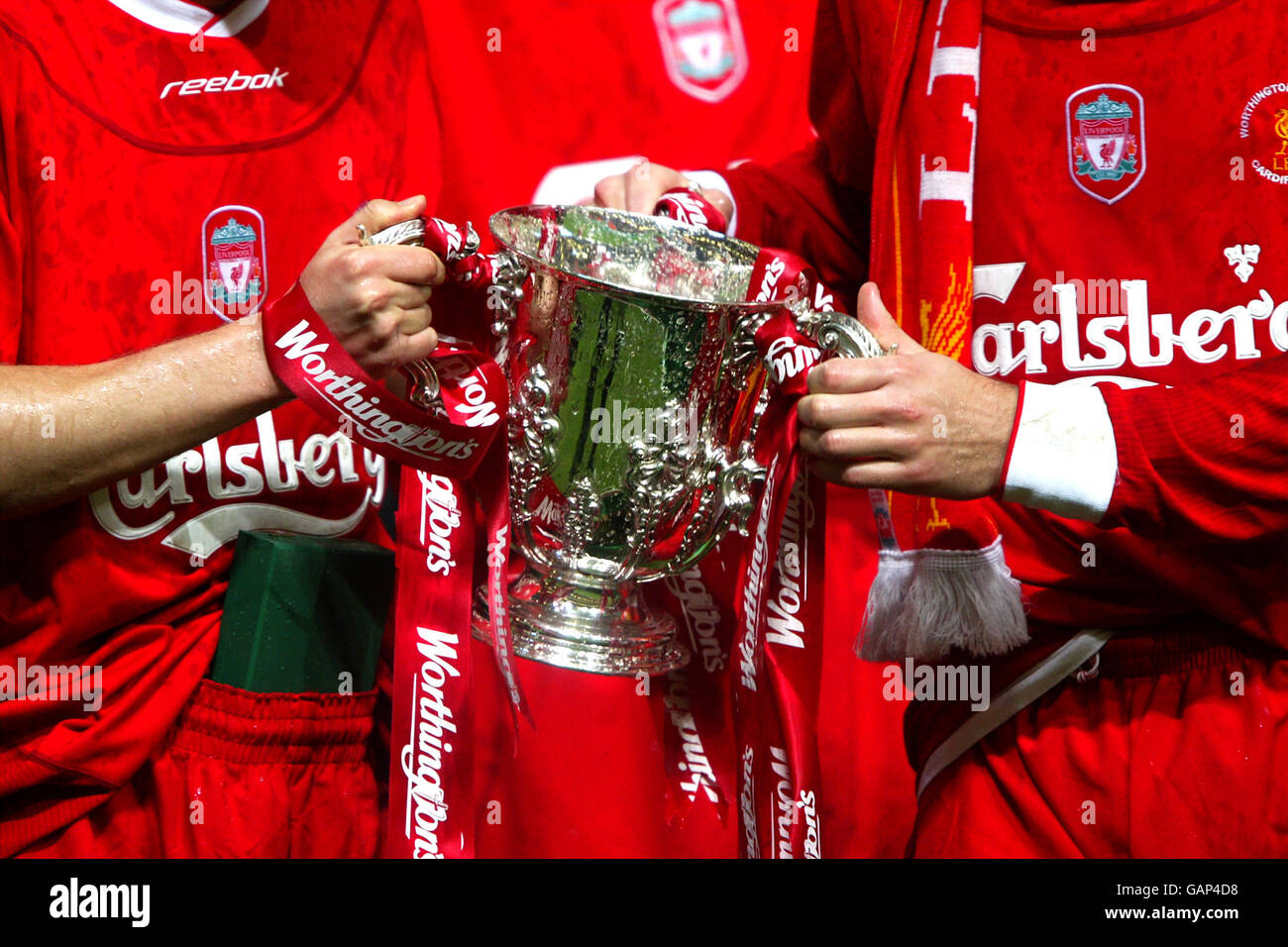 Liverpool players hold the cup hi-res stock photography and images - Alamy