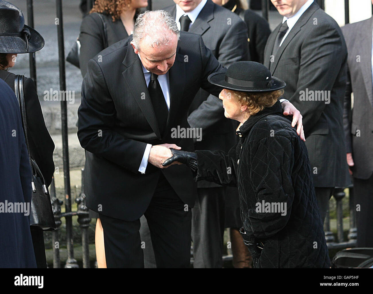 Maeve Hillery (on right) is comforted by her son John at The state ...