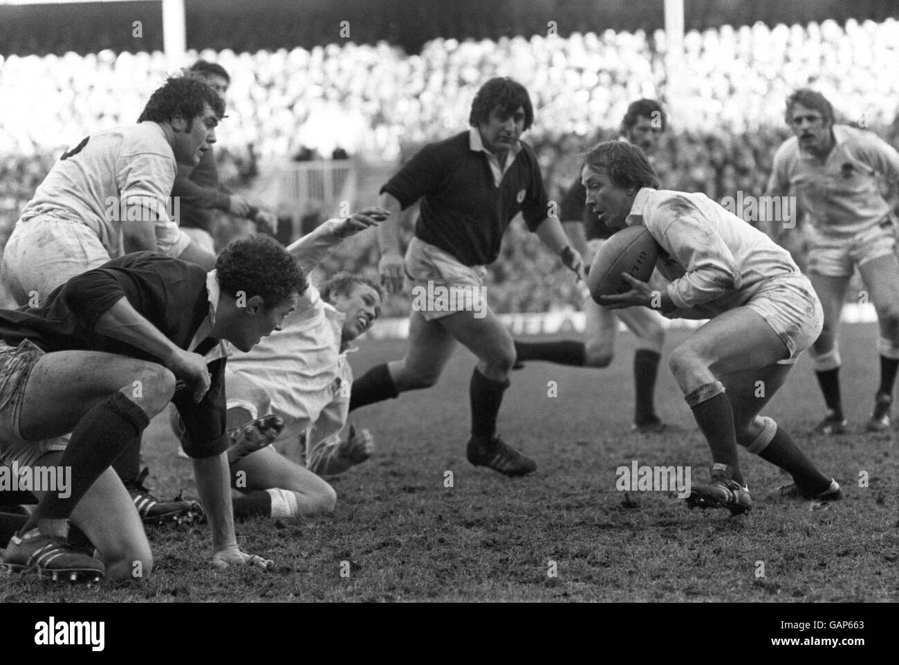 England's Peter Wheeler (c) gets the ball back to teammate Malcolm ...