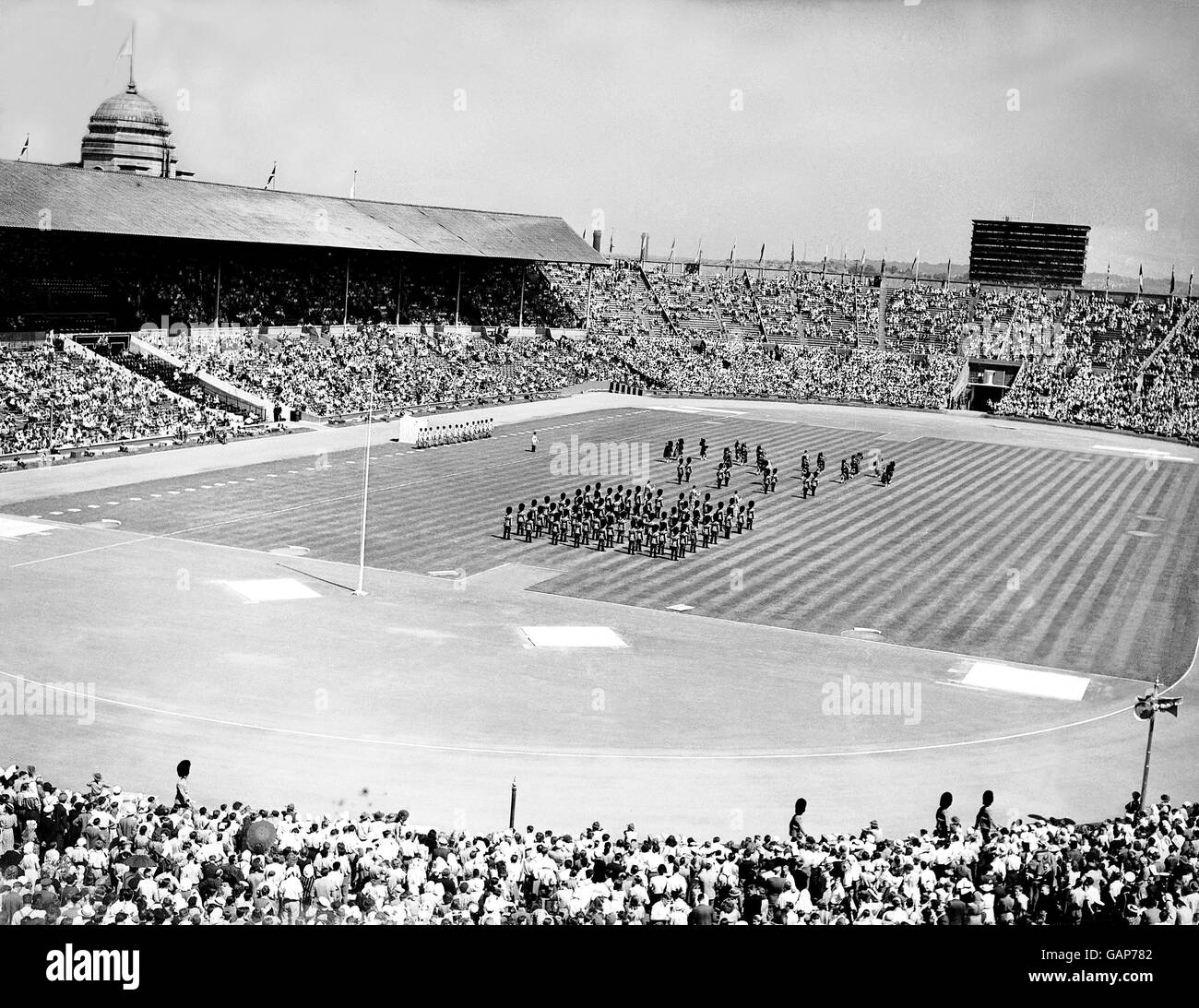 A brass band plays as Wembley Stadium slowly fills with spectators ...