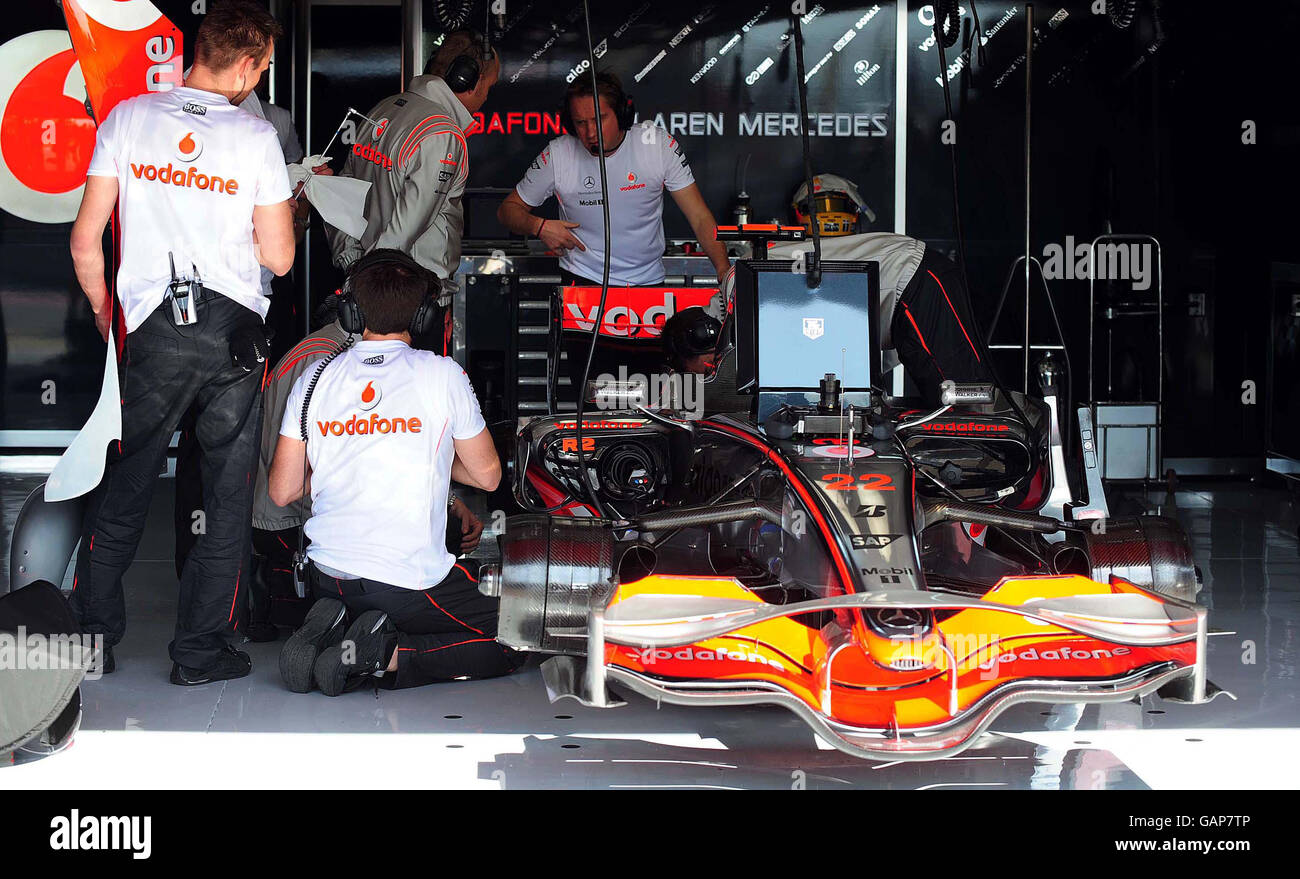 Mechanics work on lewis hamiltons car at the catalunya circuit hi-res ...