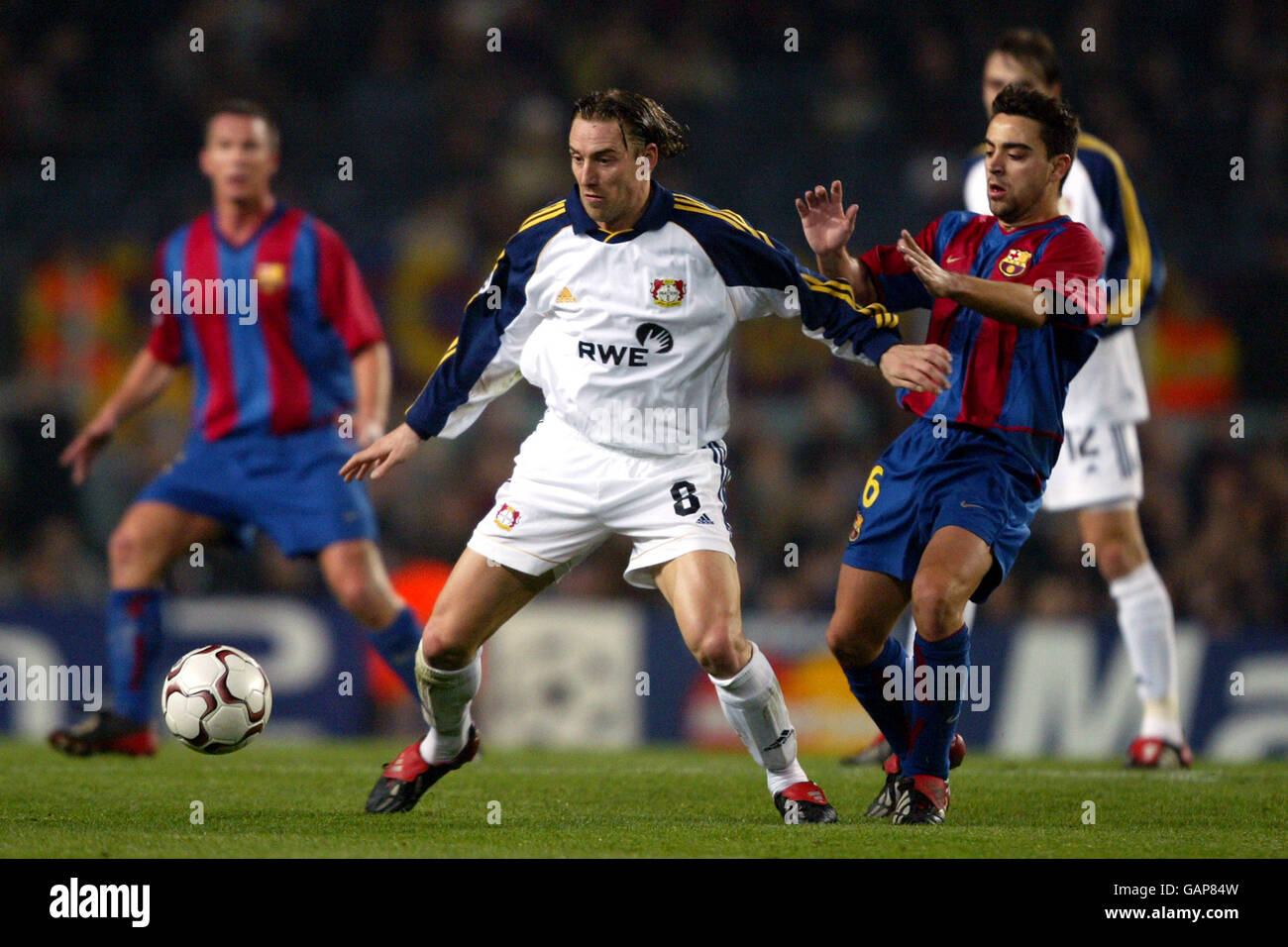 Bayer Leverkusen's Jan Simak (l) holds off Barcelona's Xavi (r Stock ...