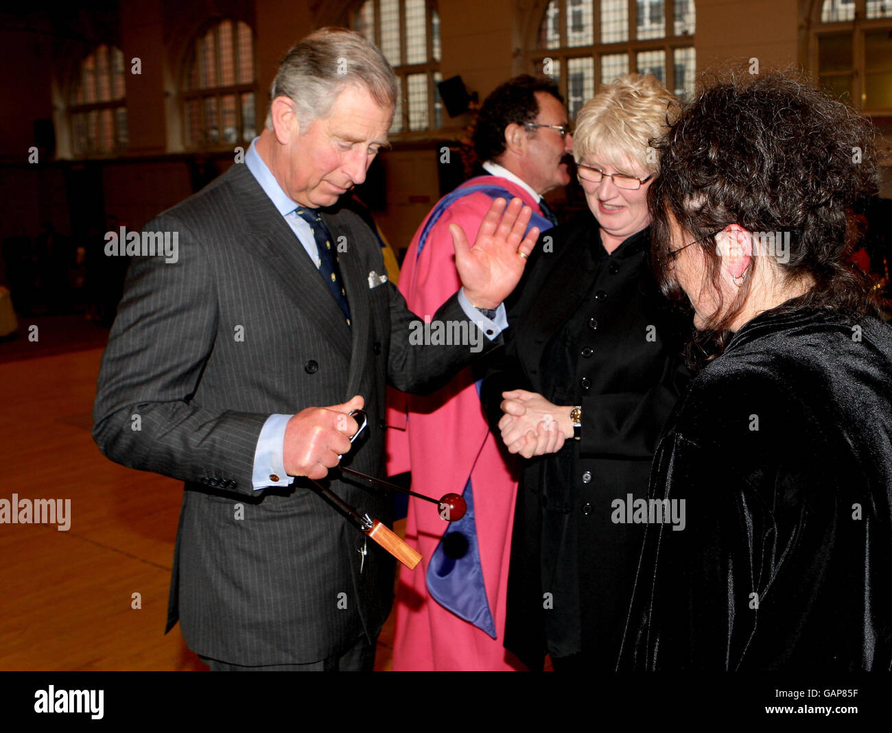 The Prince of Wales plays a vibra-slap as music consultant Jean Carter ...
