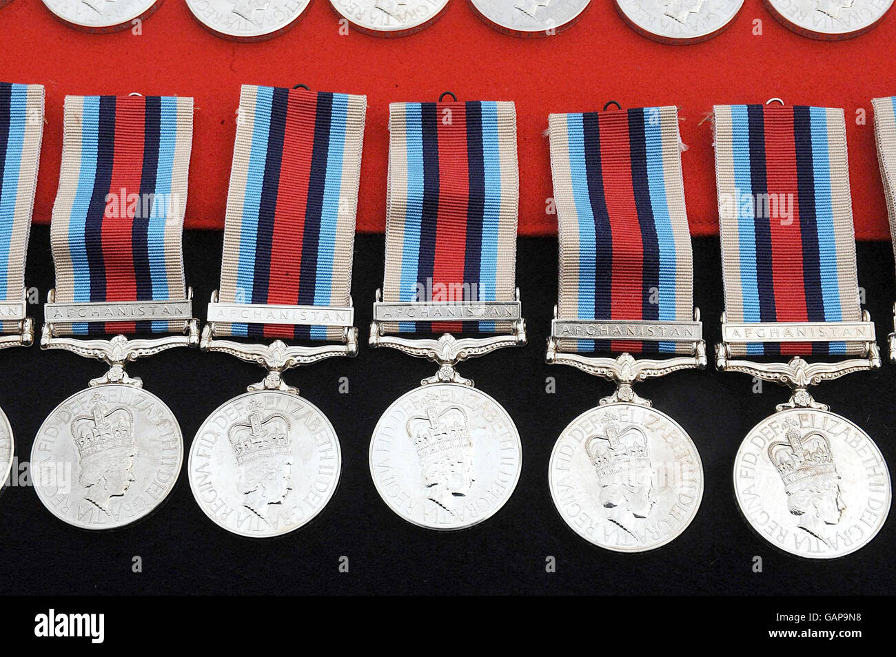 Campaign medals are laid out before being presented to Prince Harry and ...
