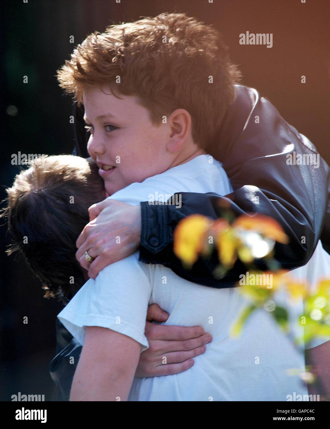 George Mizen, brother of murdered 16-year-old Jimmy Mizen, is hugged as ...