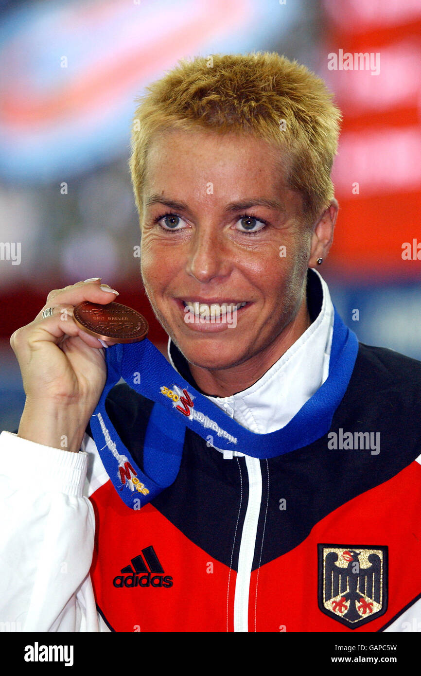 Germany's Grit Breuer celebrates with her bronze medal in the Women's ...