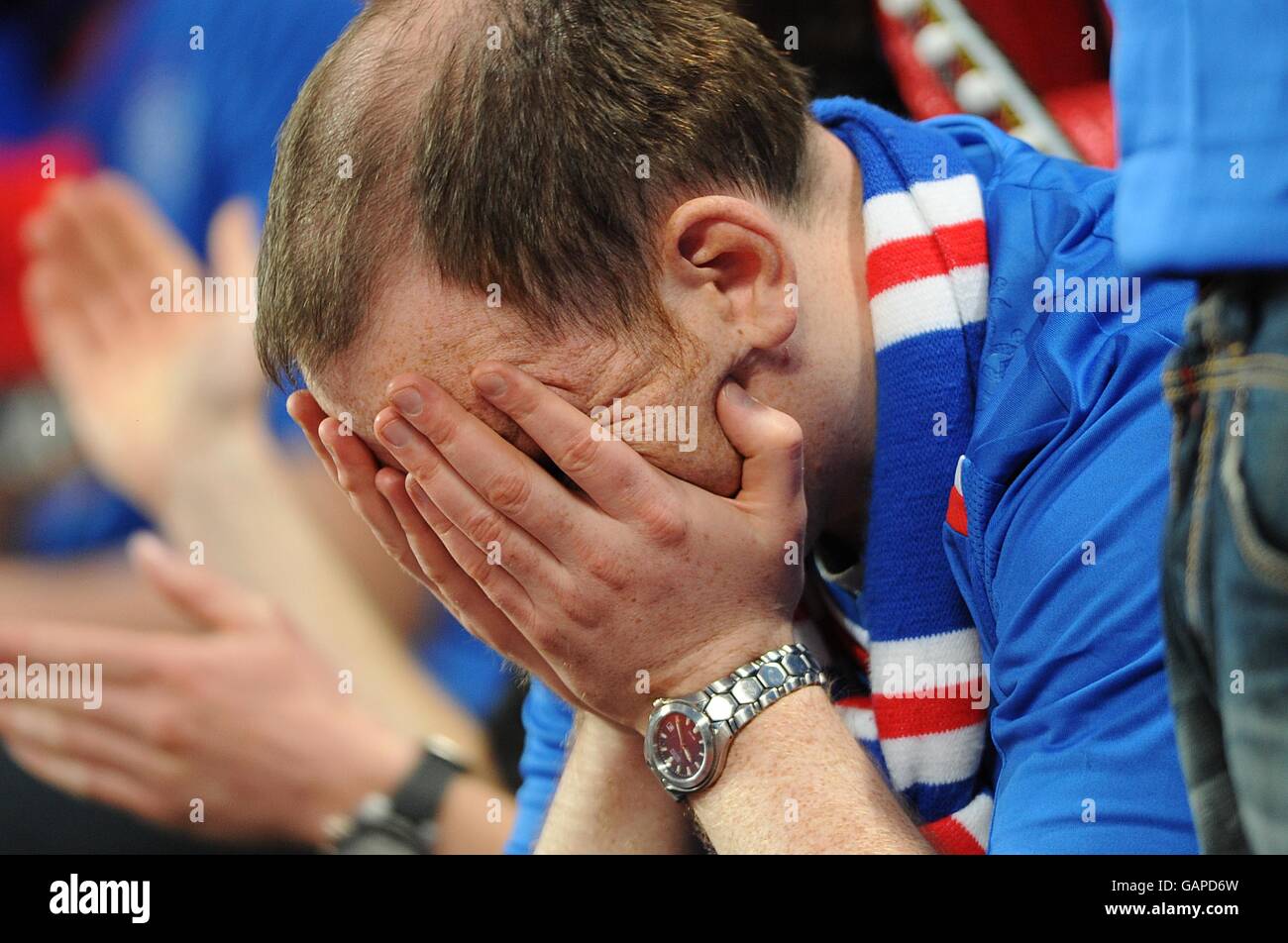 A rangers fan looks dejected in the stands hi-res stock photography and ...