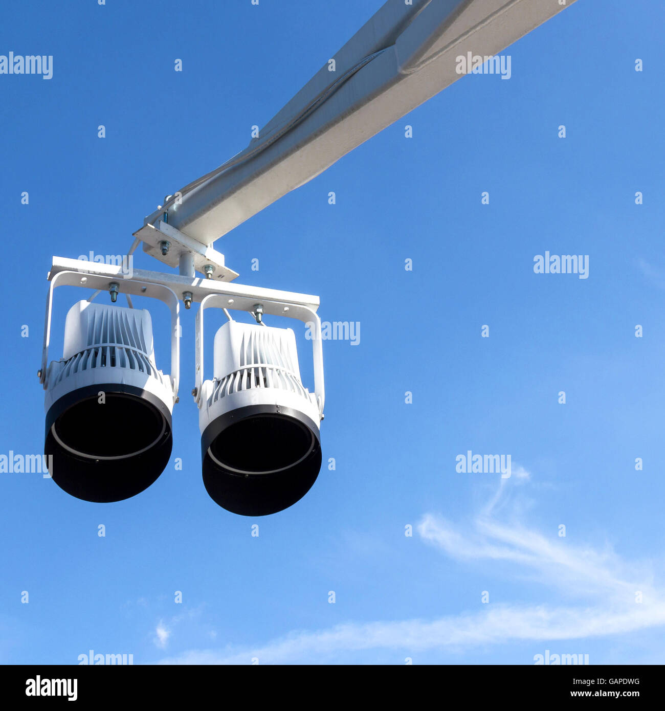 Two halogen spotlights and blue sky Stock Photo - Alamy