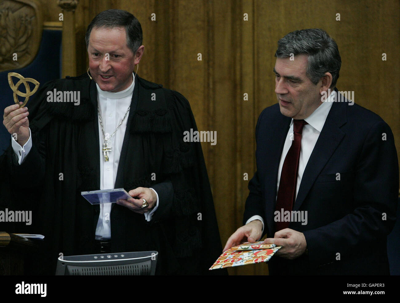 Prime Minister Gordon Brown (right) receives a gift from Moderator ...