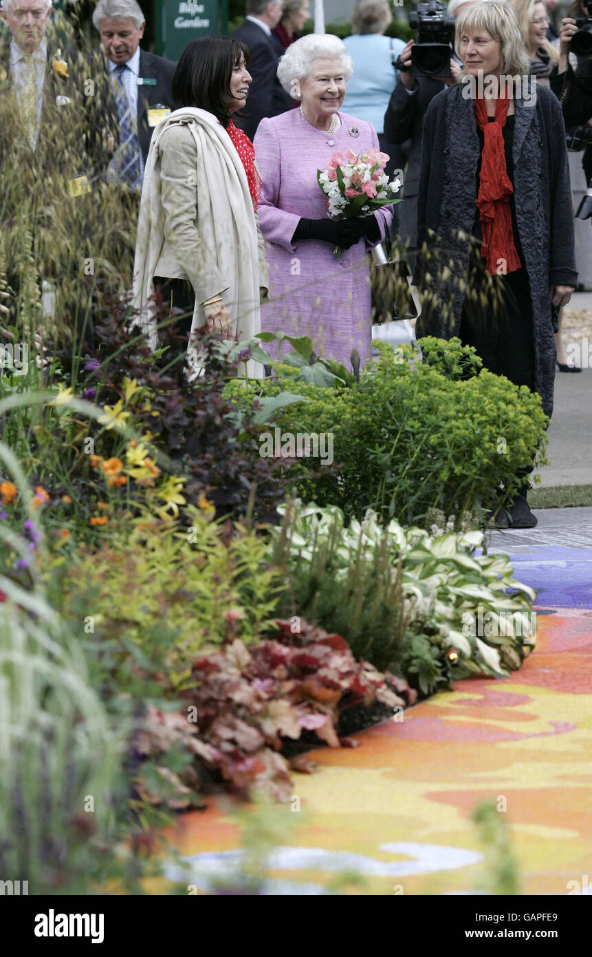 Queen Elizabeth II (centre) is shown the show garden 'From Life to Life ...