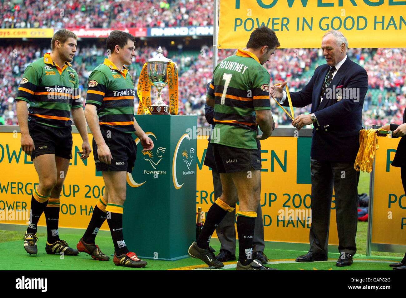 Northampton Saints' captain Budge Pountney leads his team up to collect ...