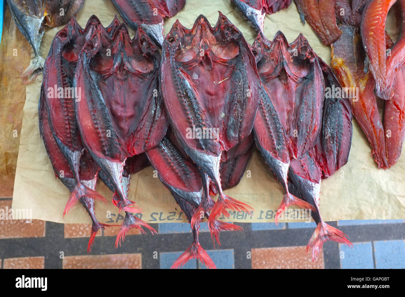 Dried fish laying on paper Stock Photo - Alamy