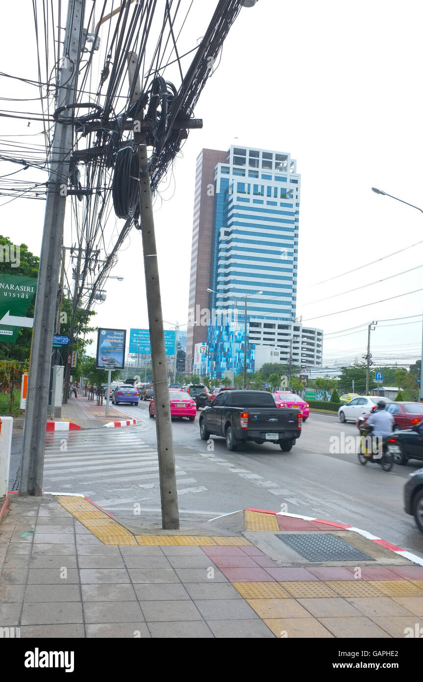 Pavement with mess wire of electric pole Stock Photo - Alamy