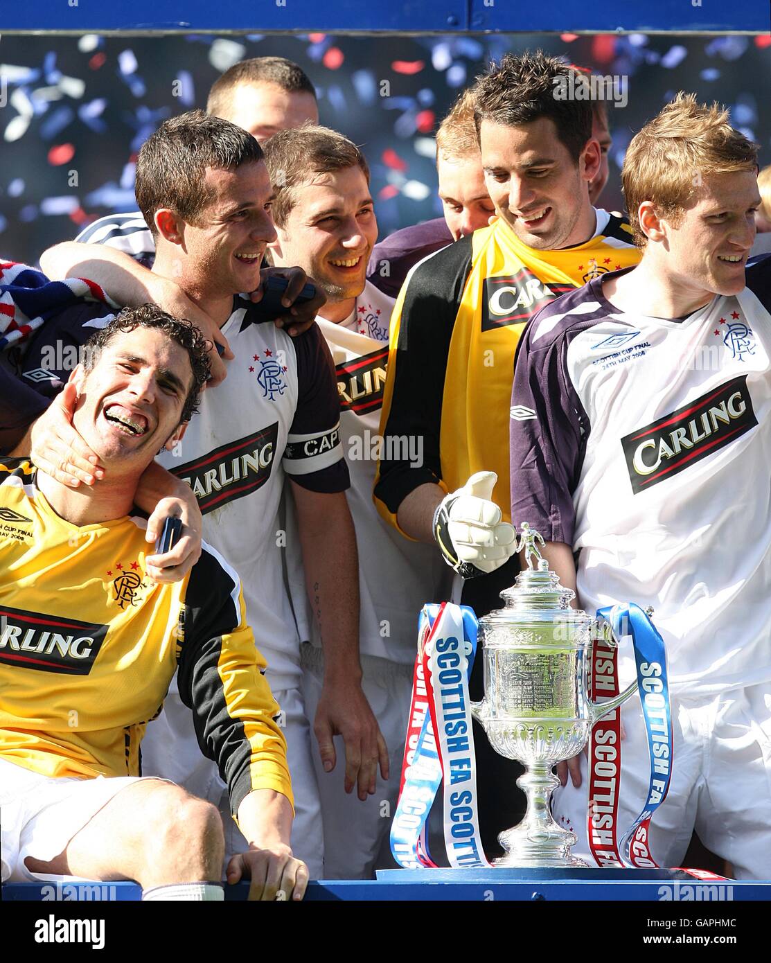 Rangers' players celebrate with the trophy after winning the Scottish ...
