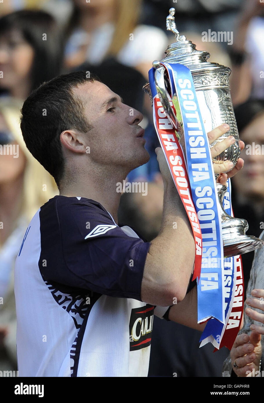 Rangers' captain Barry Ferguson lifts the trophy following their ...