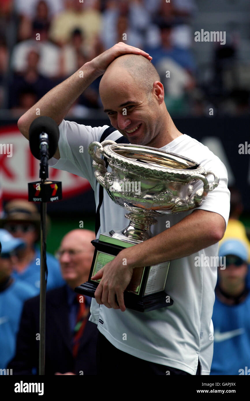 Andre agassi holds his australian open trophy hi-res stock photography ...