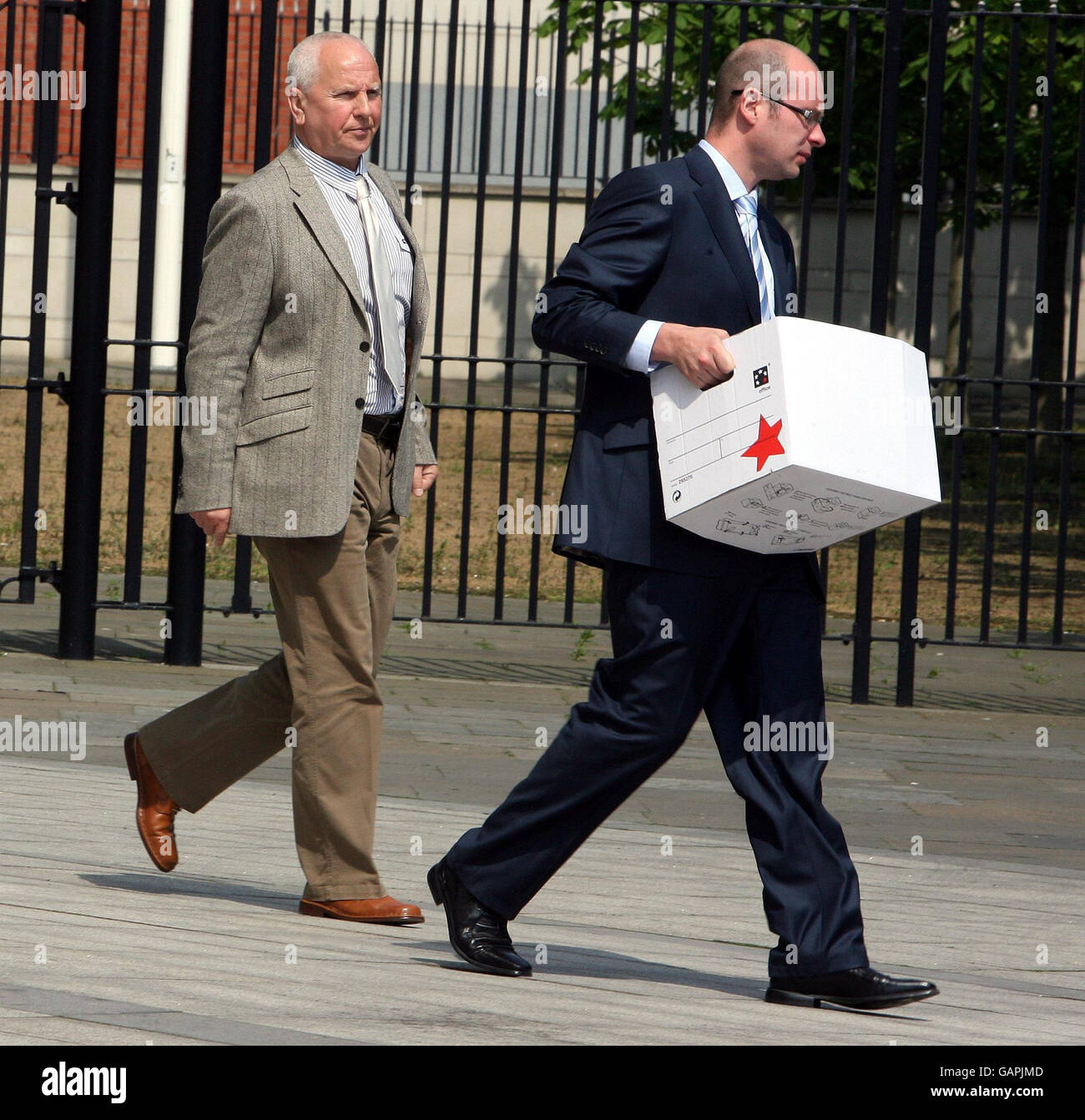 Terence Malachy Davison (left) leaves Belfast Crown Court, Belfast ...