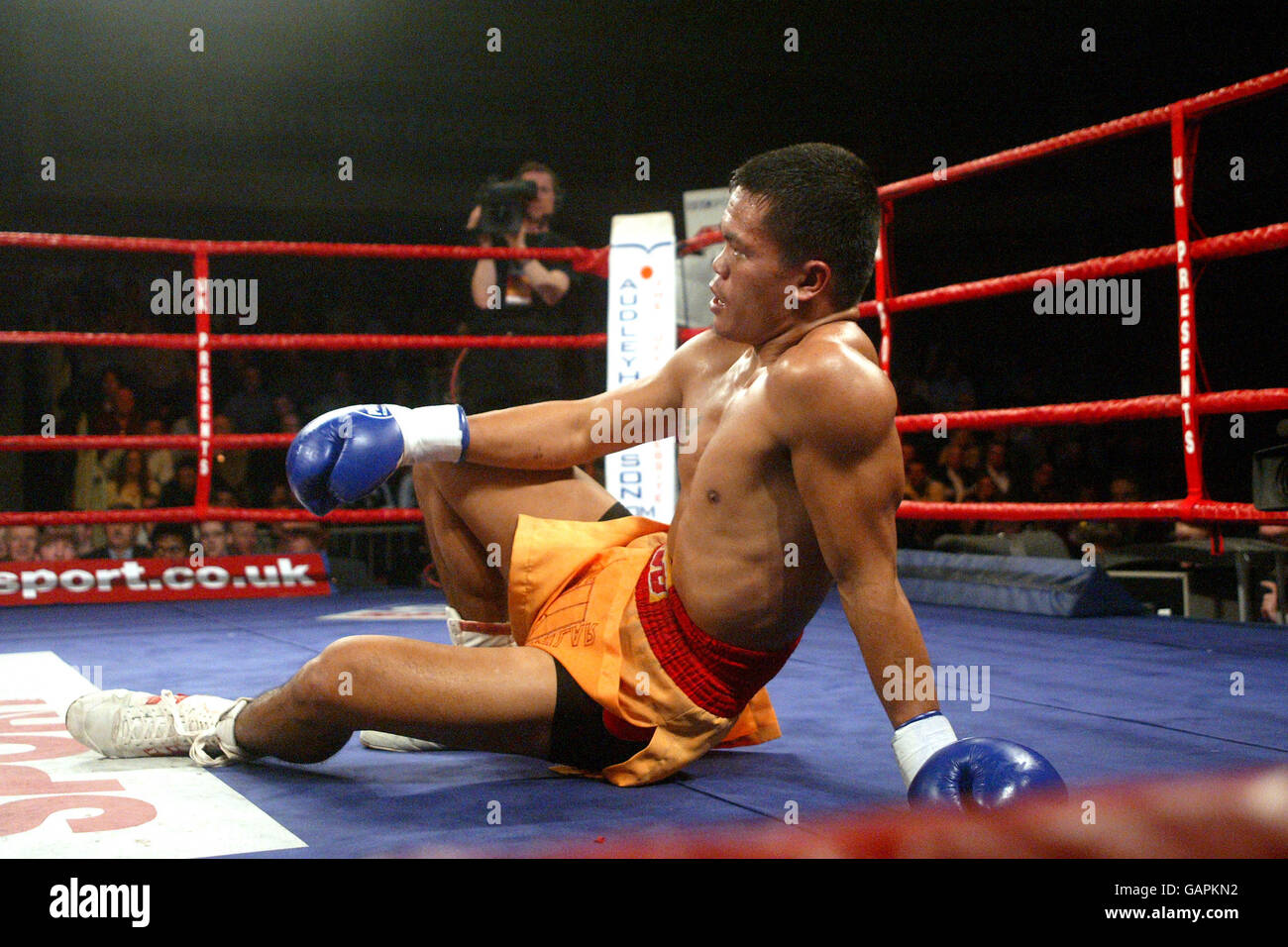 Boxing - Light Middleweight Bout - Adrian Stone v Sultan Dondon. Sultan Dondon lies on the ...