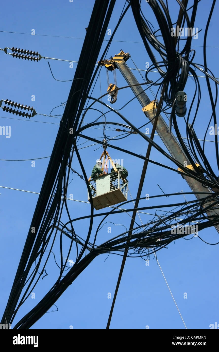 Electrical workers working in electric hi-res stock photography and ...