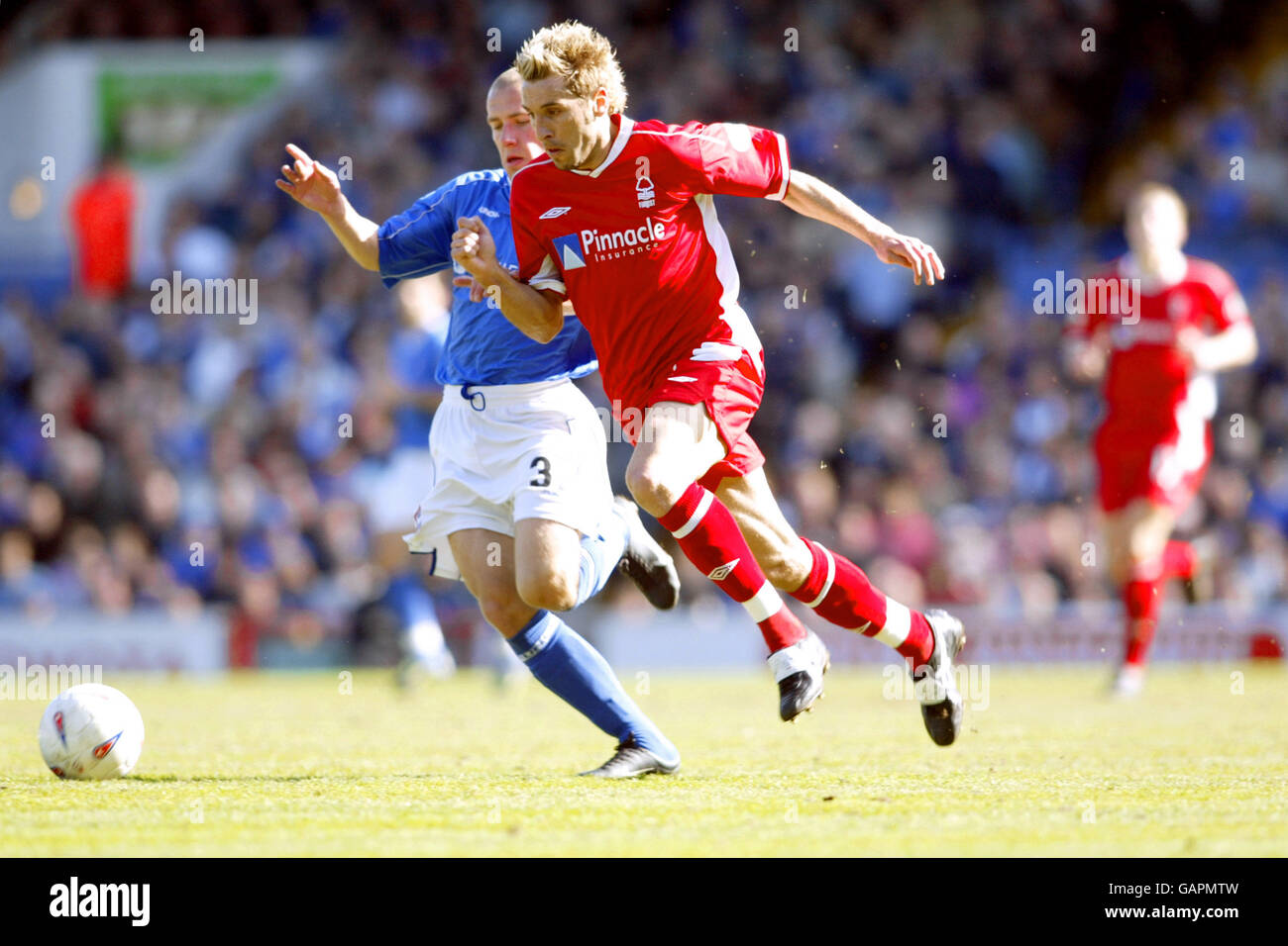 Nottingham Forest's Darren Huckerby runs past Ipswich Town Matt ...