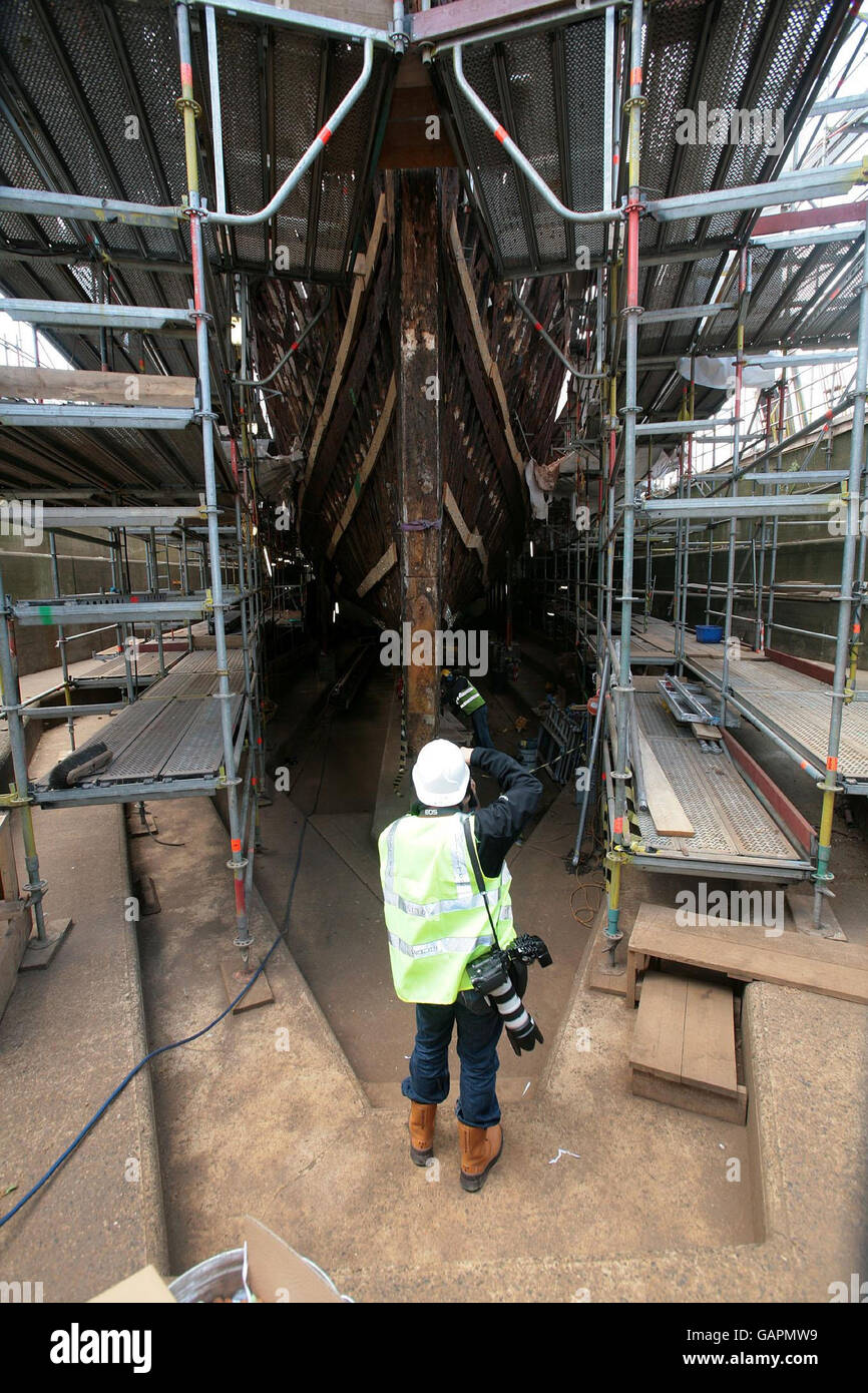 Cutty Sark restoration. A photographer takes pictures of the Cutty Sark ...