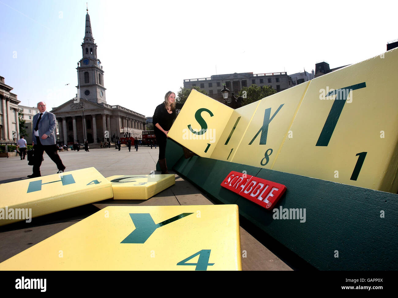 Jacey Bunker constructs a seven-metre wide Scrabble tile rack with one ...