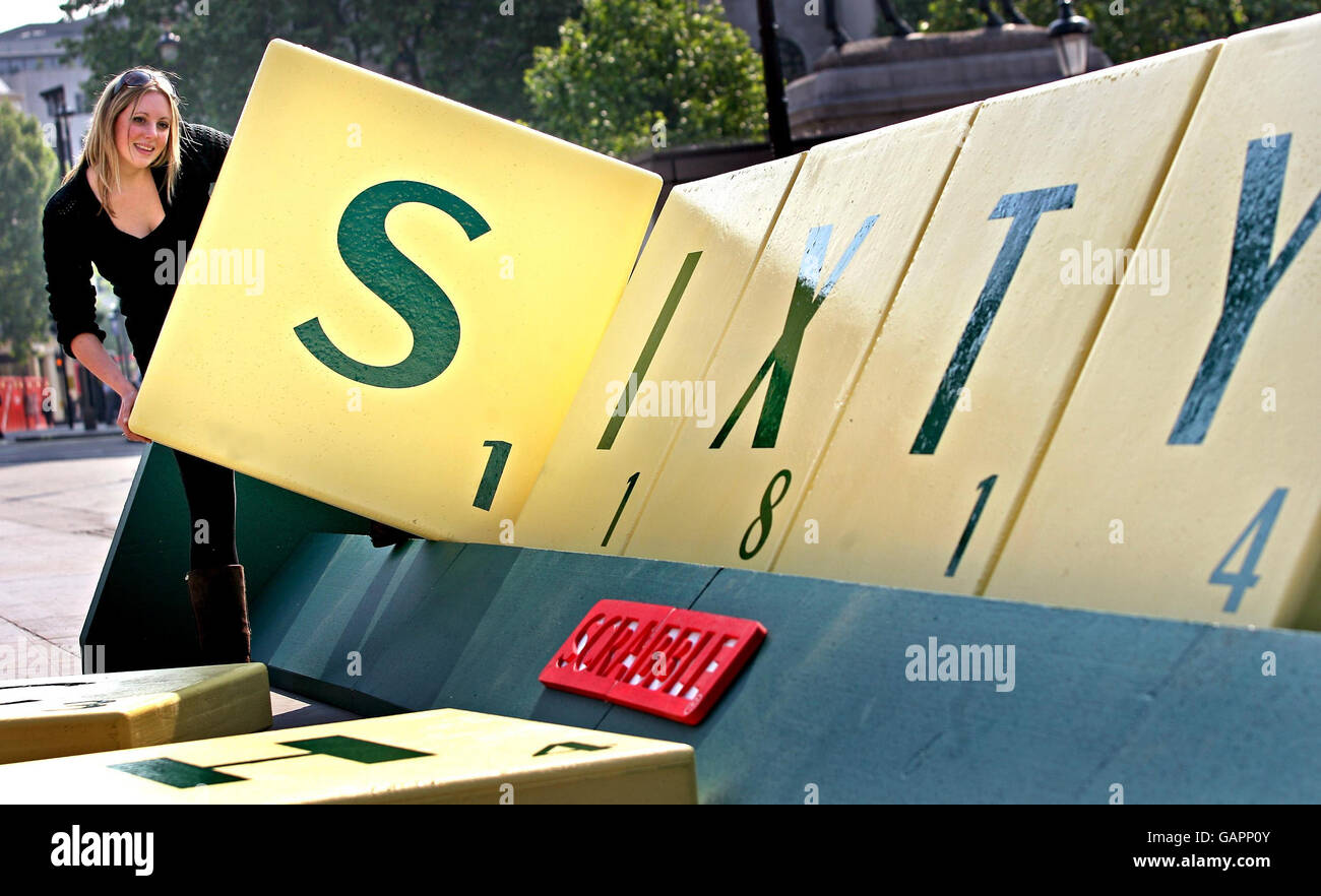Jacey Bunker constructs a seven-metre wide Scrabble tile rack with one ...