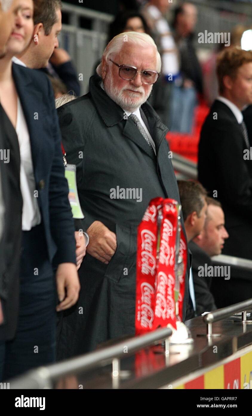 Leeds United Chairman Ken Bates walks past the trophy as his side ...