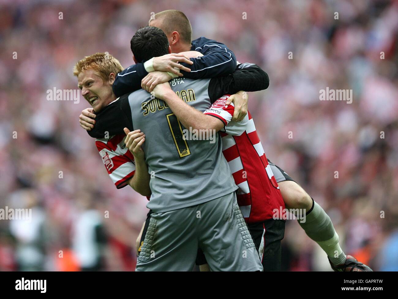 Doncaster Rovers' Neil Sullivan (centre) celebrates with team mates ...