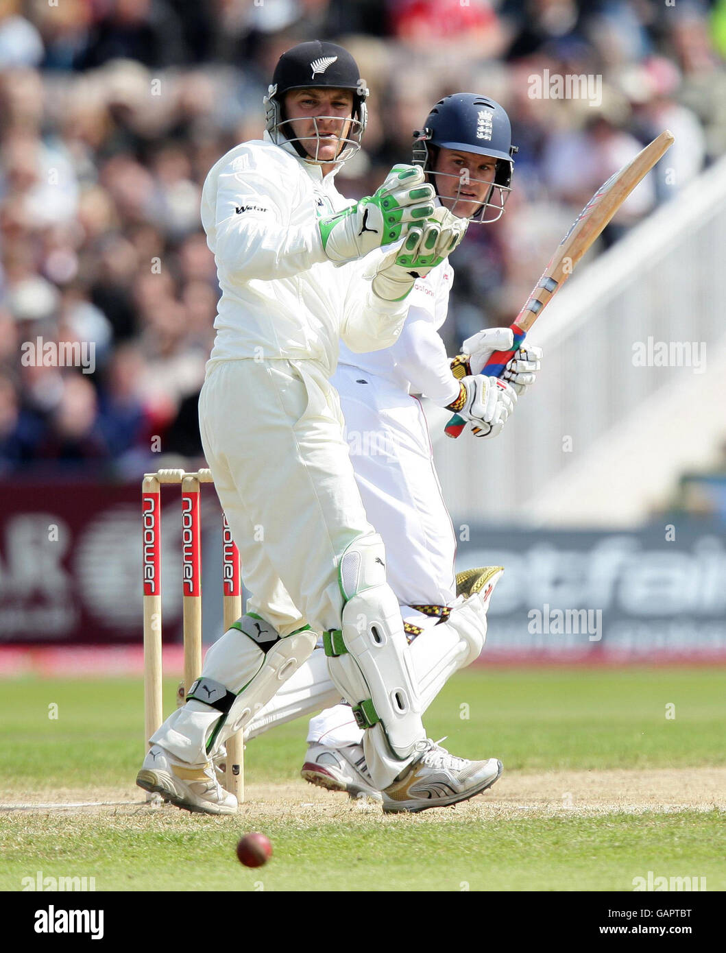 Full length action batting ball helmet mangrs hi-res stock photography ...