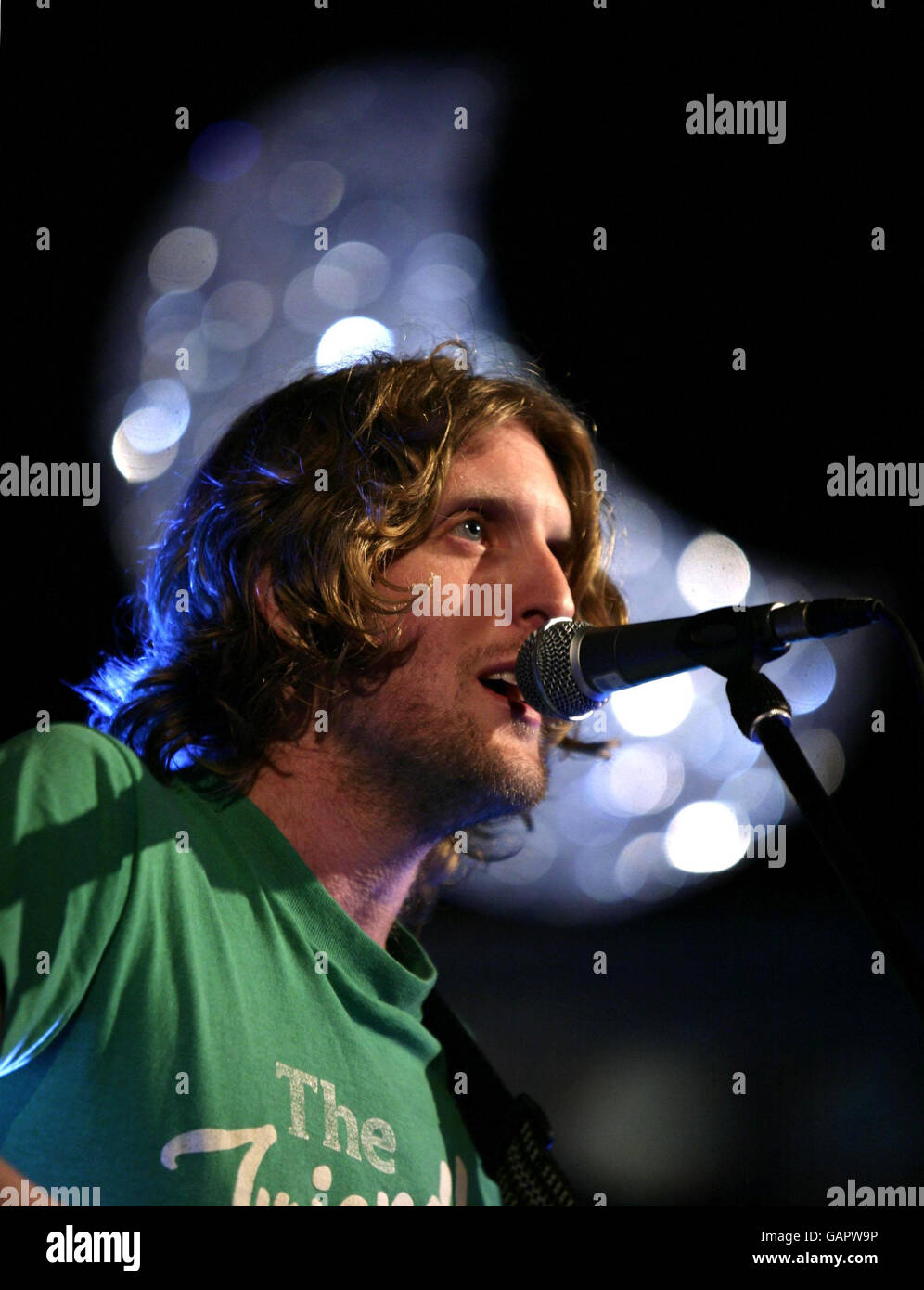 Razorlight drummer Andy Burrows performing with guitar on stage with guests during a gig ...