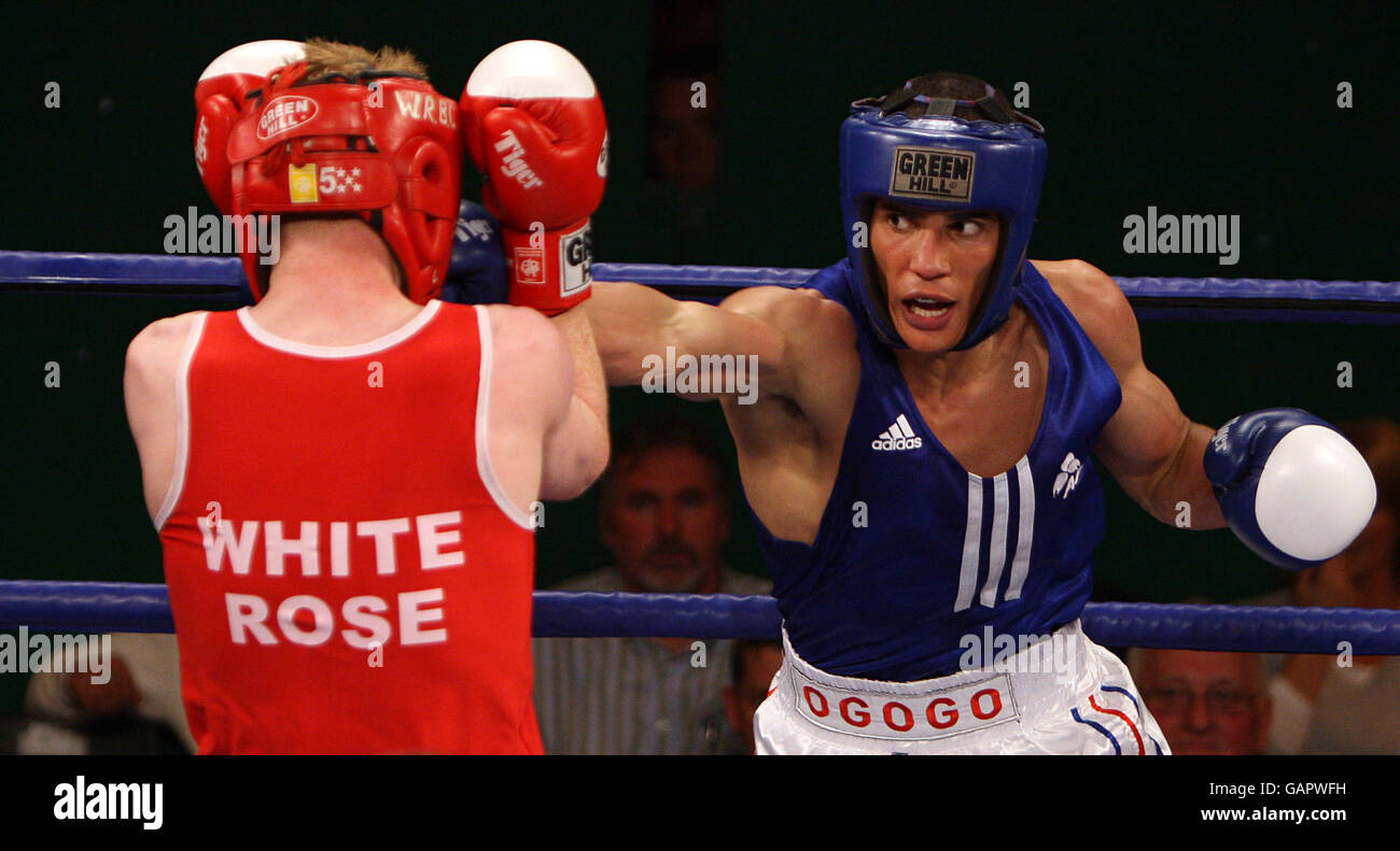Anthony Ogogo (blue) in action during his win over Luke Robinson (red ...