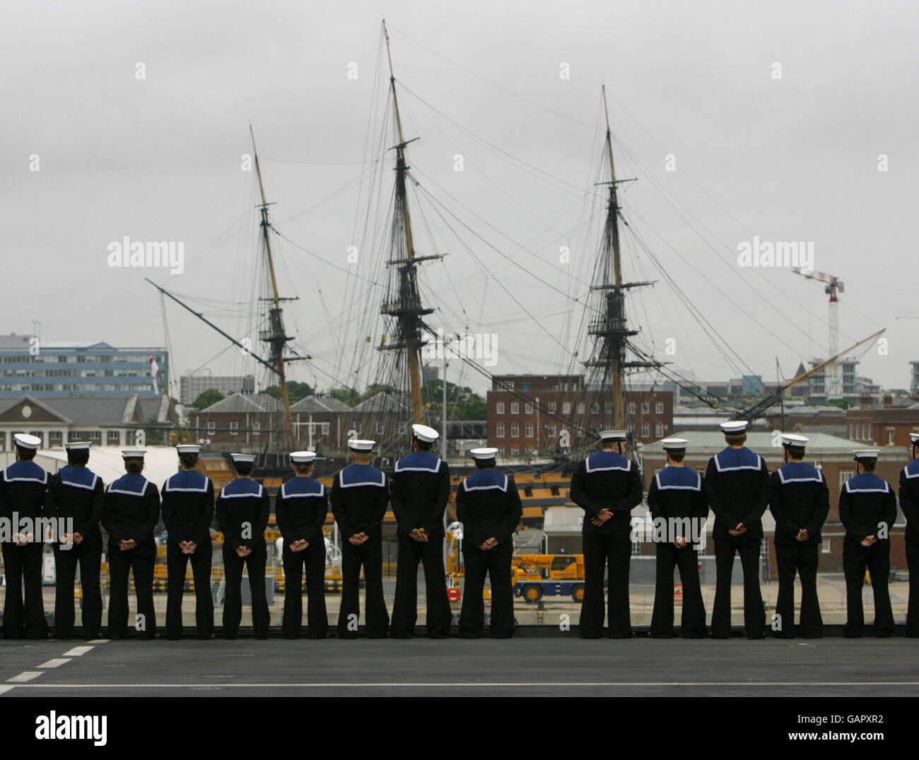 HMS Illustrious passes HMS Victory as she returns to Portsmouth Naval ...