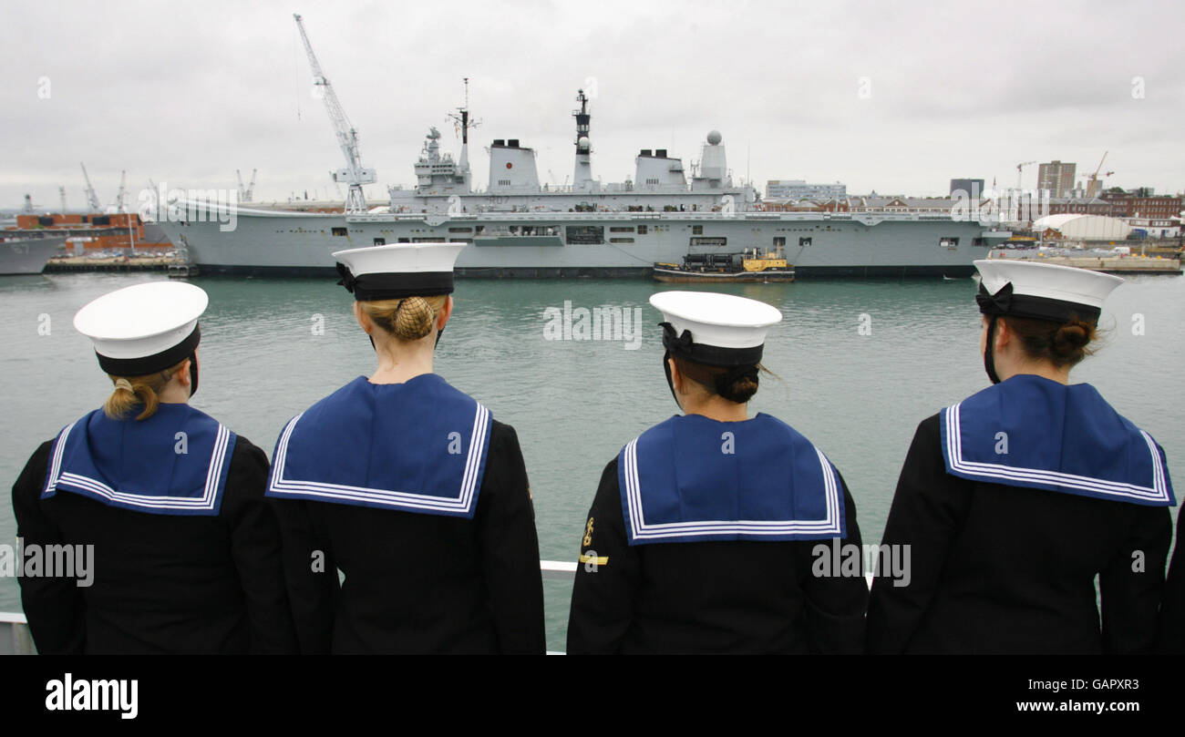 HMS Illustrious passes the Royal Naval Flagship HMS Ark Royal (top) as ...