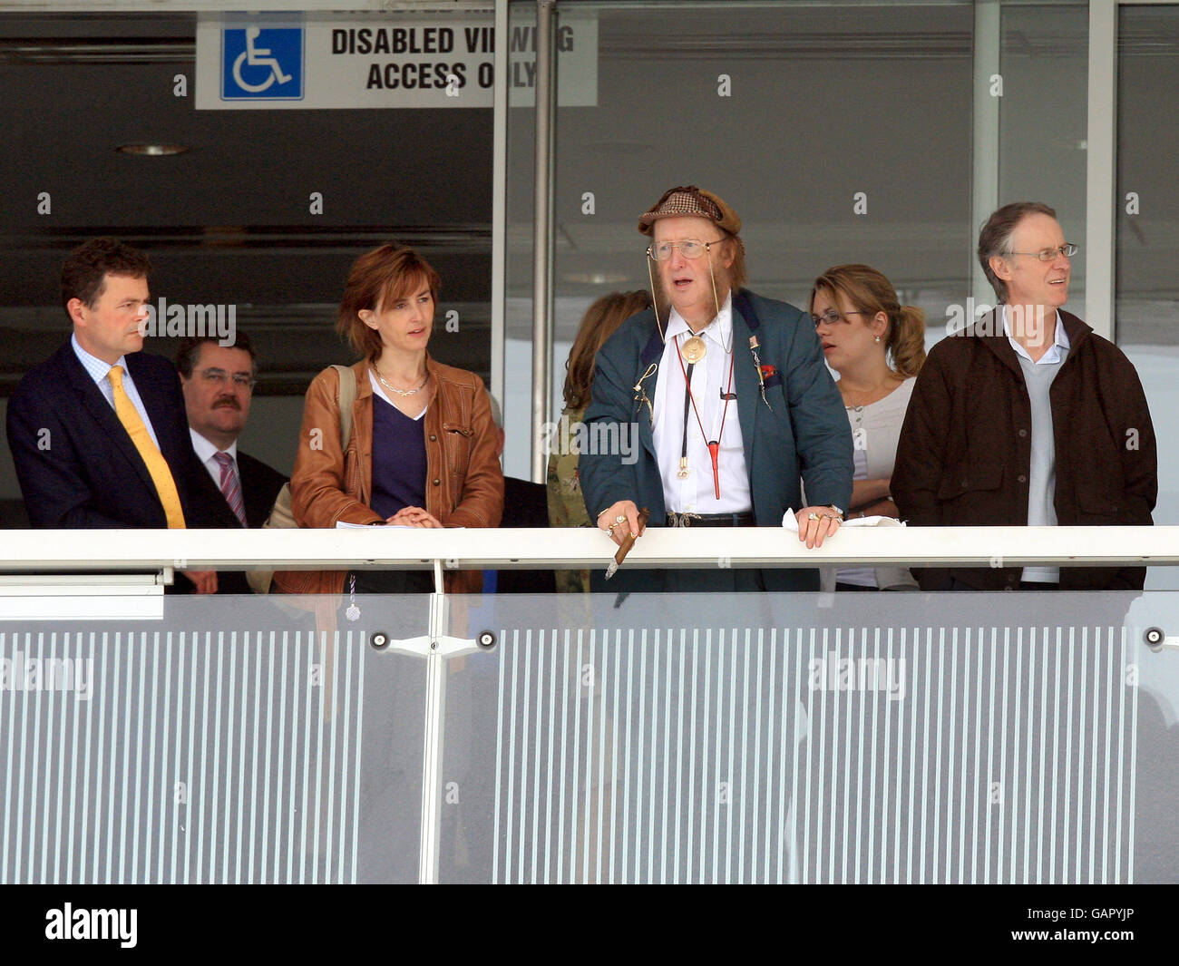 Channel 4 Racing Pundit John McCririck (centre, right) watches from the ...