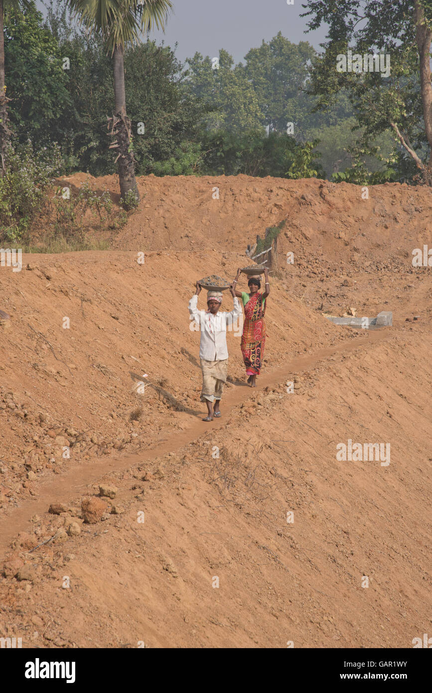 People building a reservoir in a water irrigation project in a rural ...