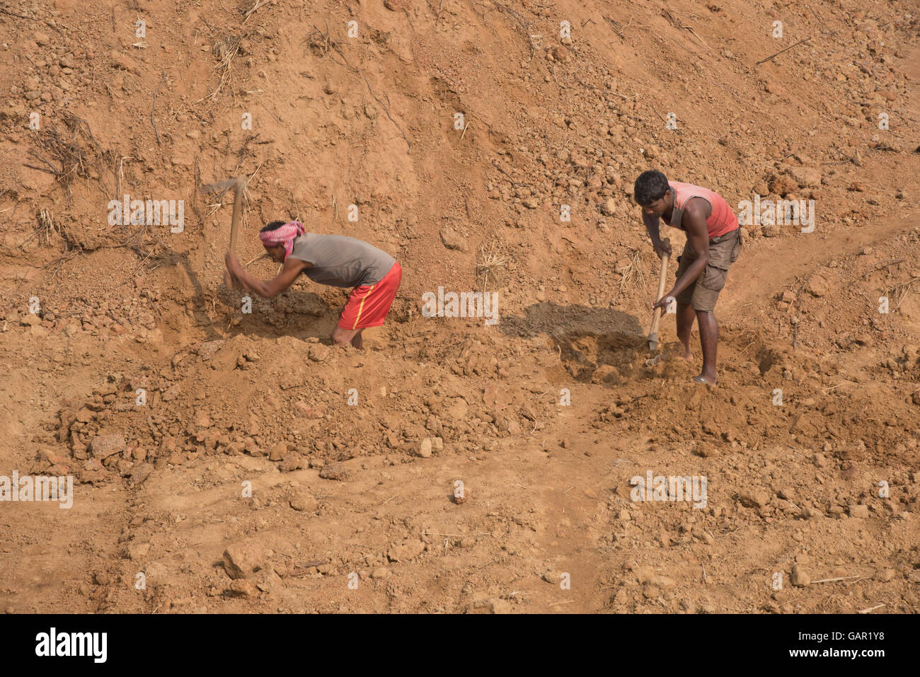 People building a reservoir in a water irrigation project in a rural ...