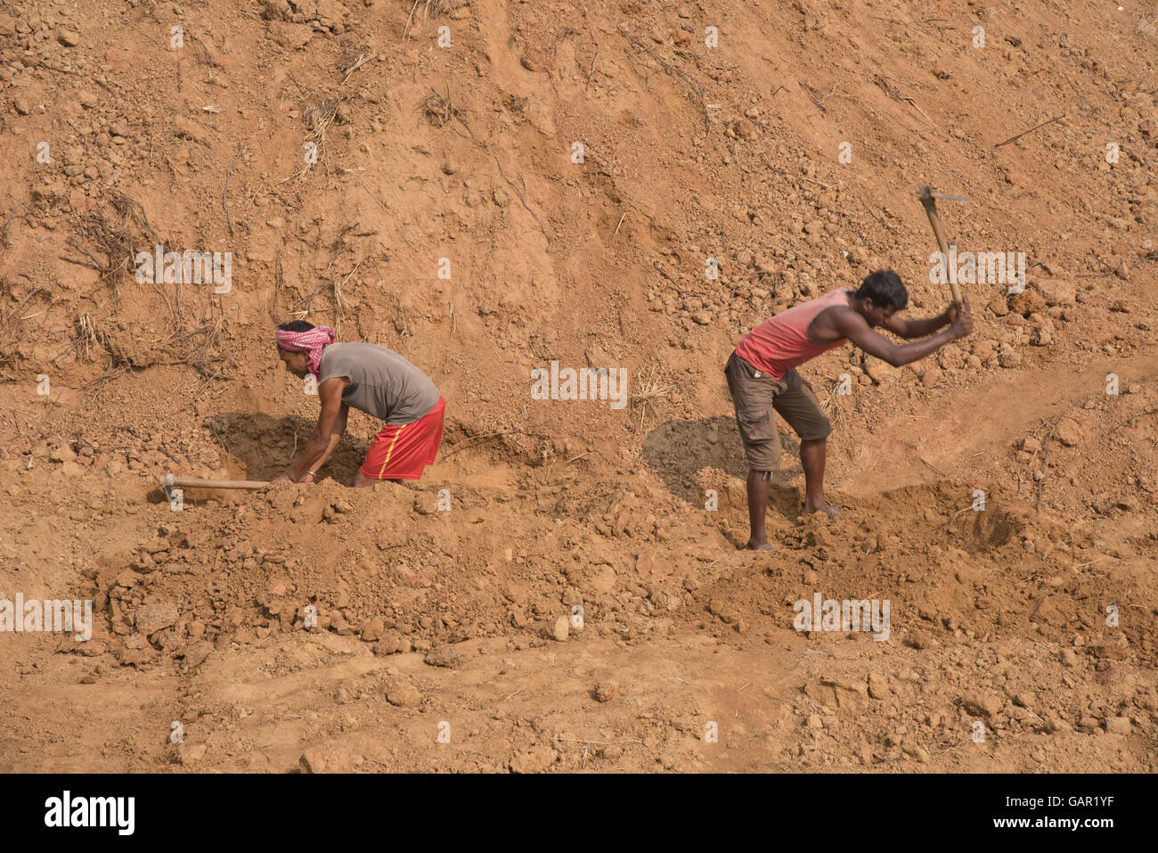People building a reservoir in a water irrigation project in a rural ...