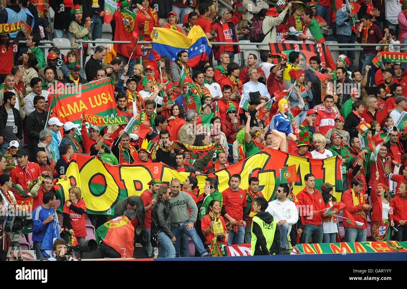 Portugal fans cheer on their side in the crowd hi-res stock photography ...