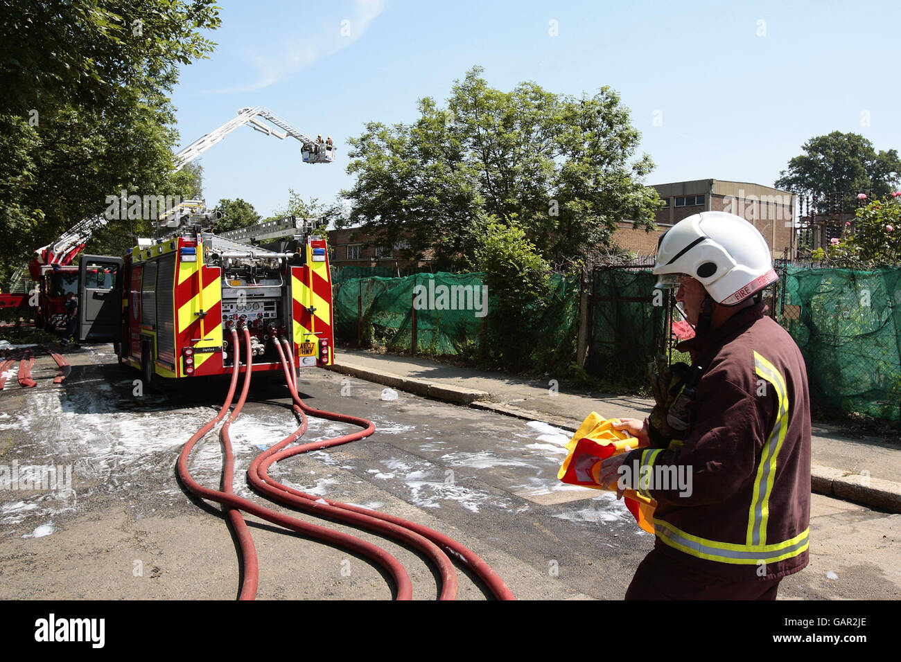 Firefighters tackle a fire at an an electricity sub station in Sydenham ...