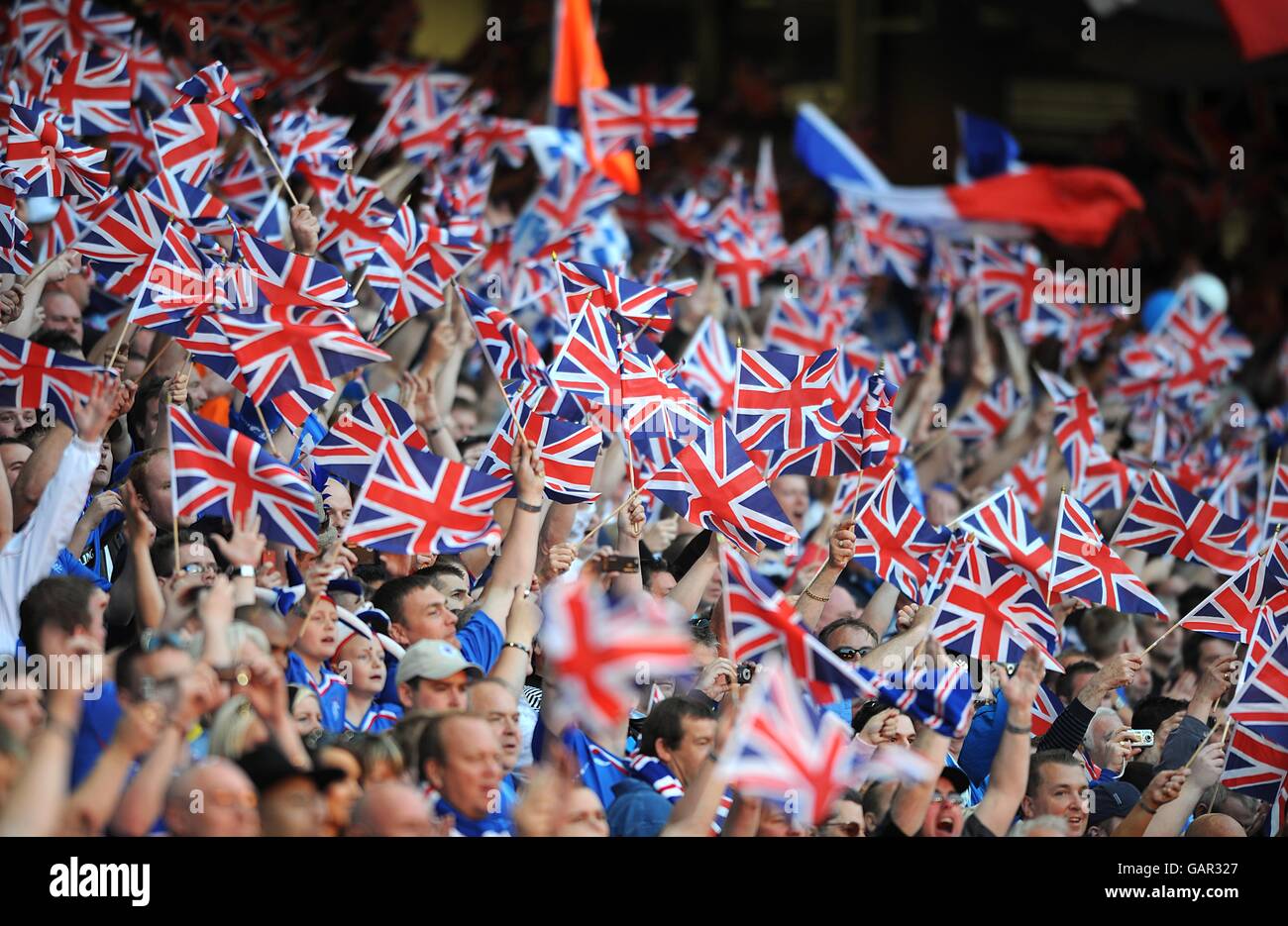 Rangers fans wave union jack flags in the stands hi-res stock ...