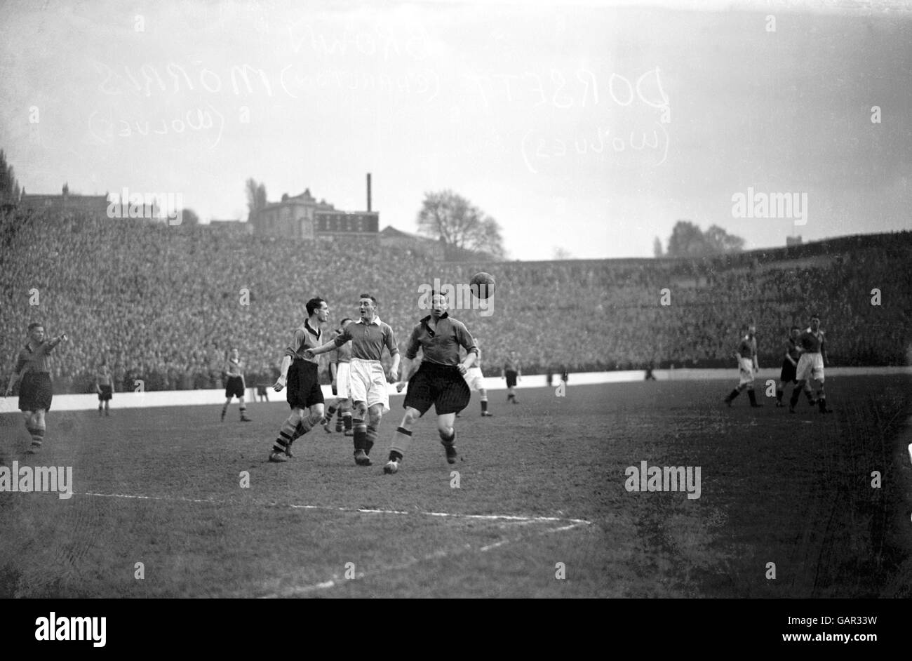 Wolverhampton Wanderers' Dicky Dorsett (r) and Bill Morris (l) pull up ...
