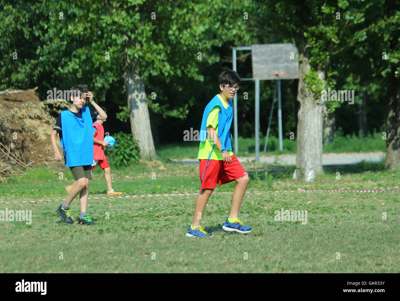 two young brothers playing soccer with the blue jacket Stock Photo - Alamy