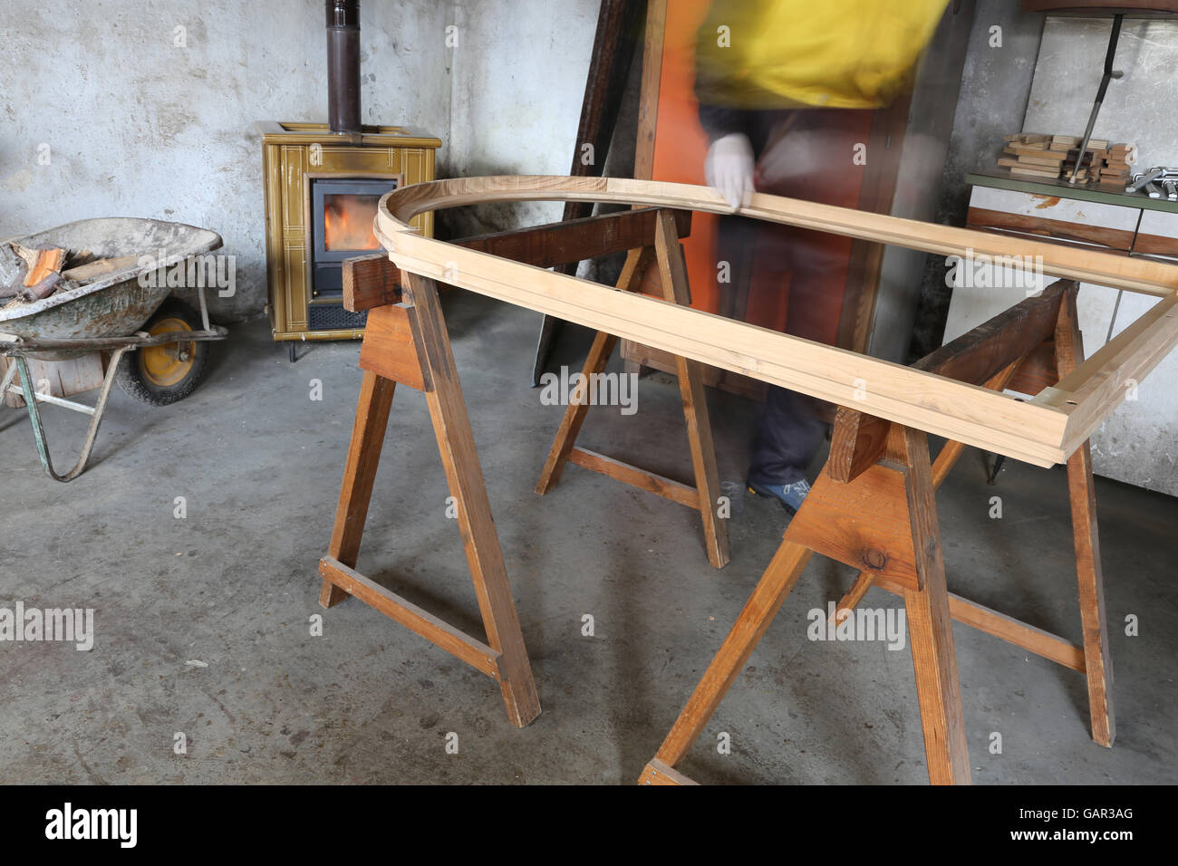 expert Carpenter worker during painting and restoration of an old ...