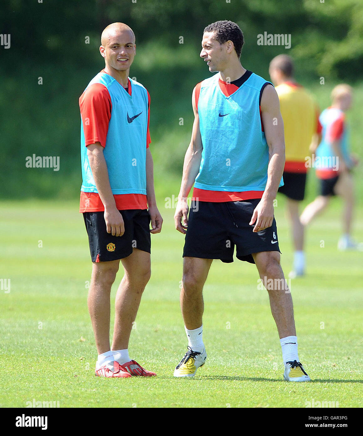Manchester United's Rio Ferdinand (right) chats to Wes Brown during the ...