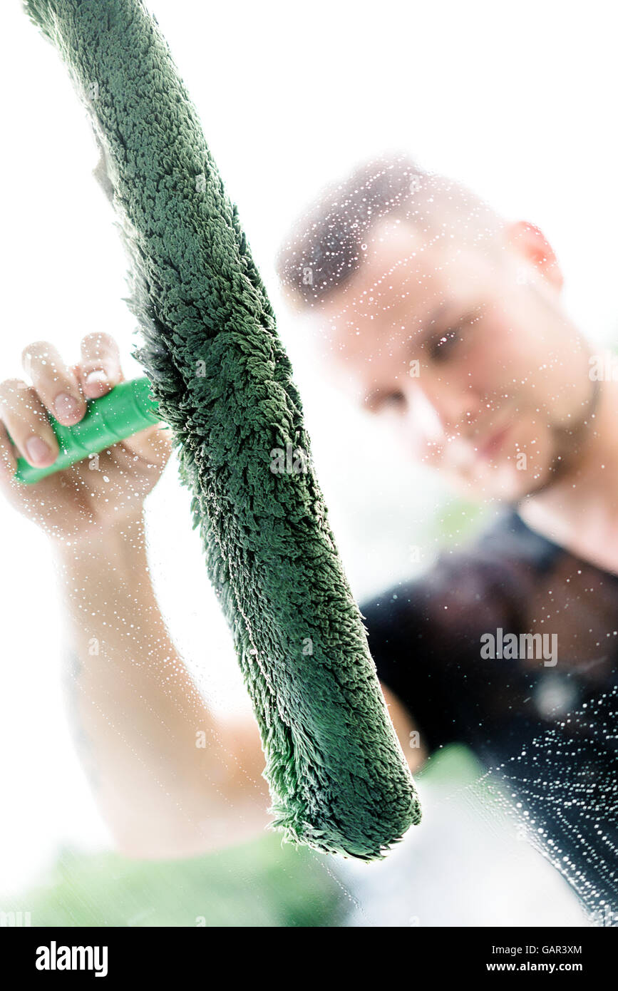 Male window cleaner outside (MR Stock Photo - Alamy