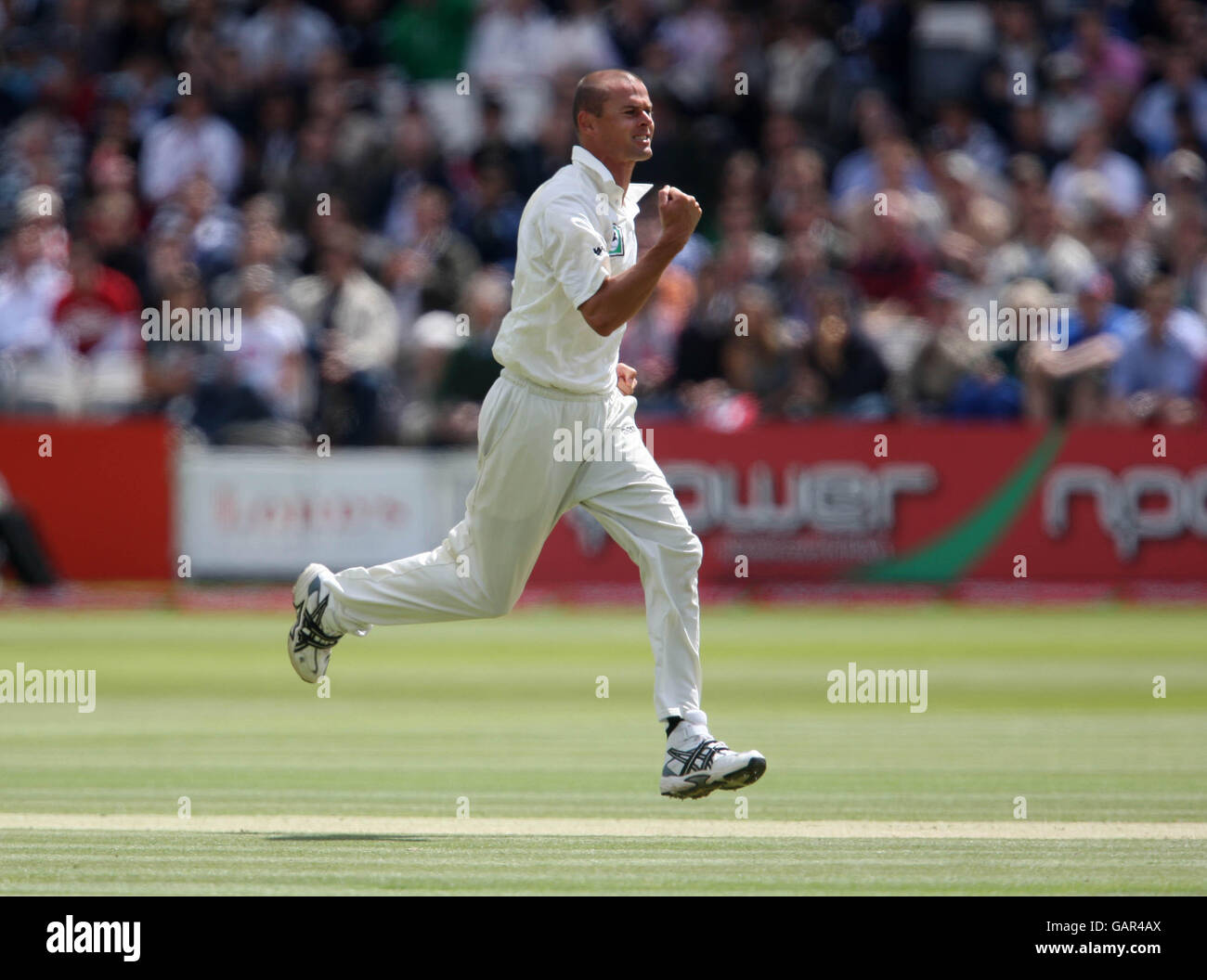 New Zealand's Chris Martin celebrates taking the wicket of England's ...