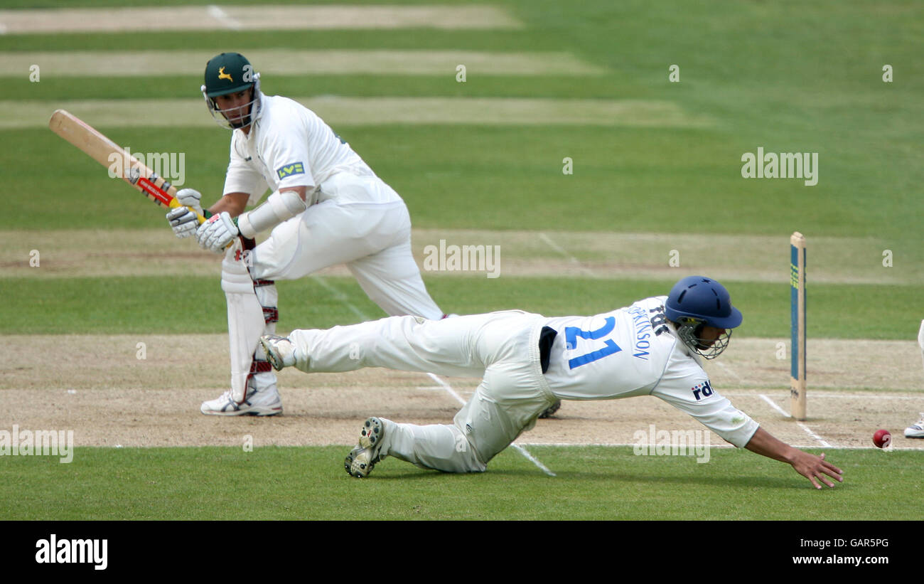 Nottinghamshire's Mark Wagh hits a four as Sussex's Carl Hopkinson ...