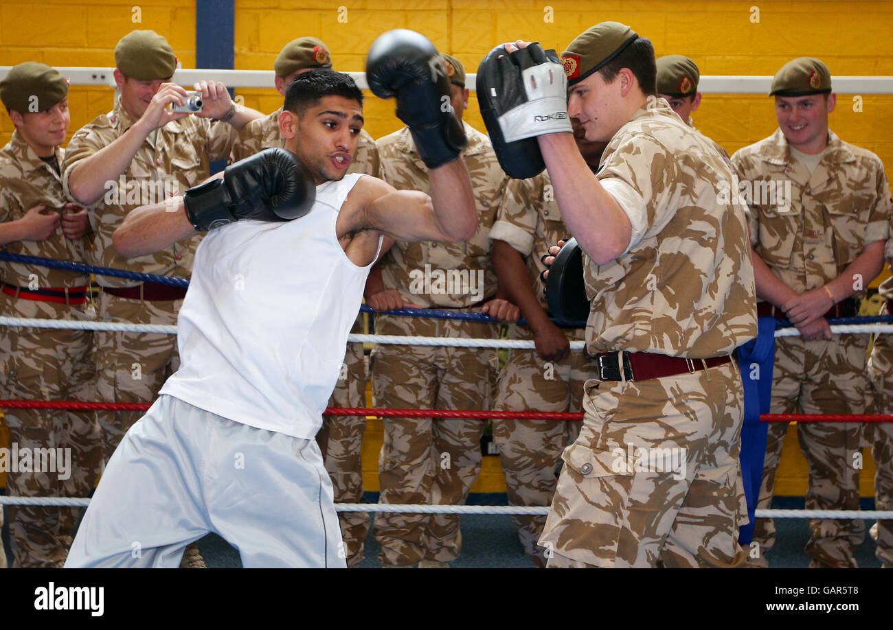 Boxer Amir Khan (left) spares with Kingsman Scott Craven of the 1st ...